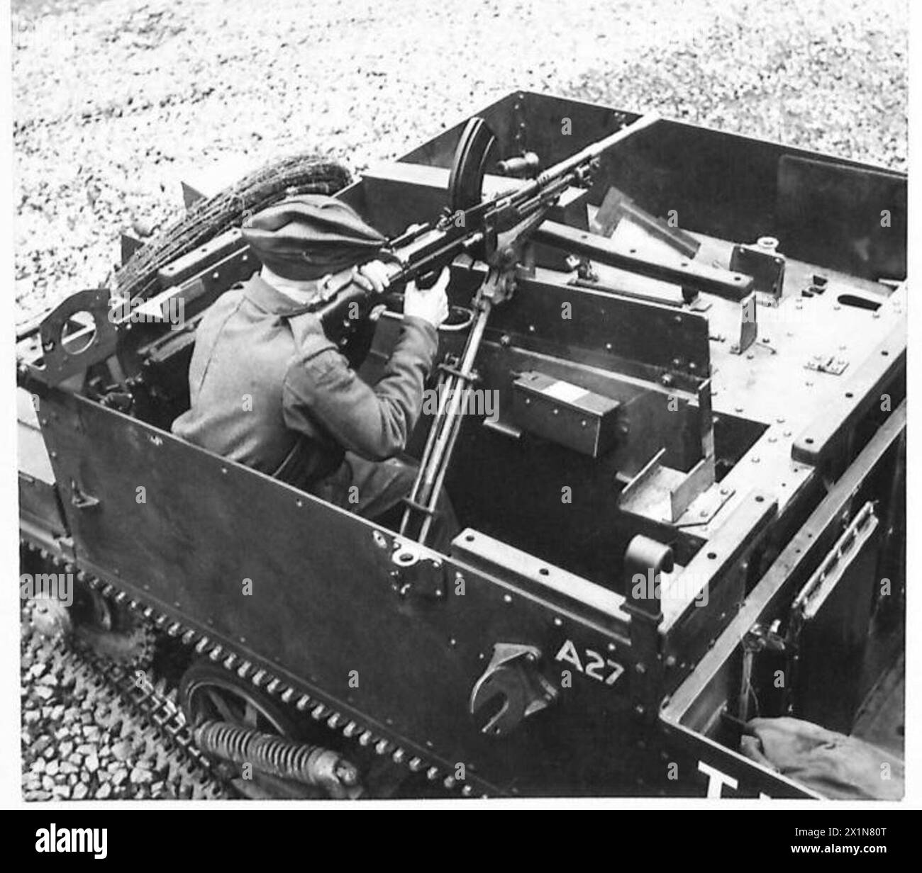 A Bren gun mounted on a Bren Carrier fires to the left-hand side ...