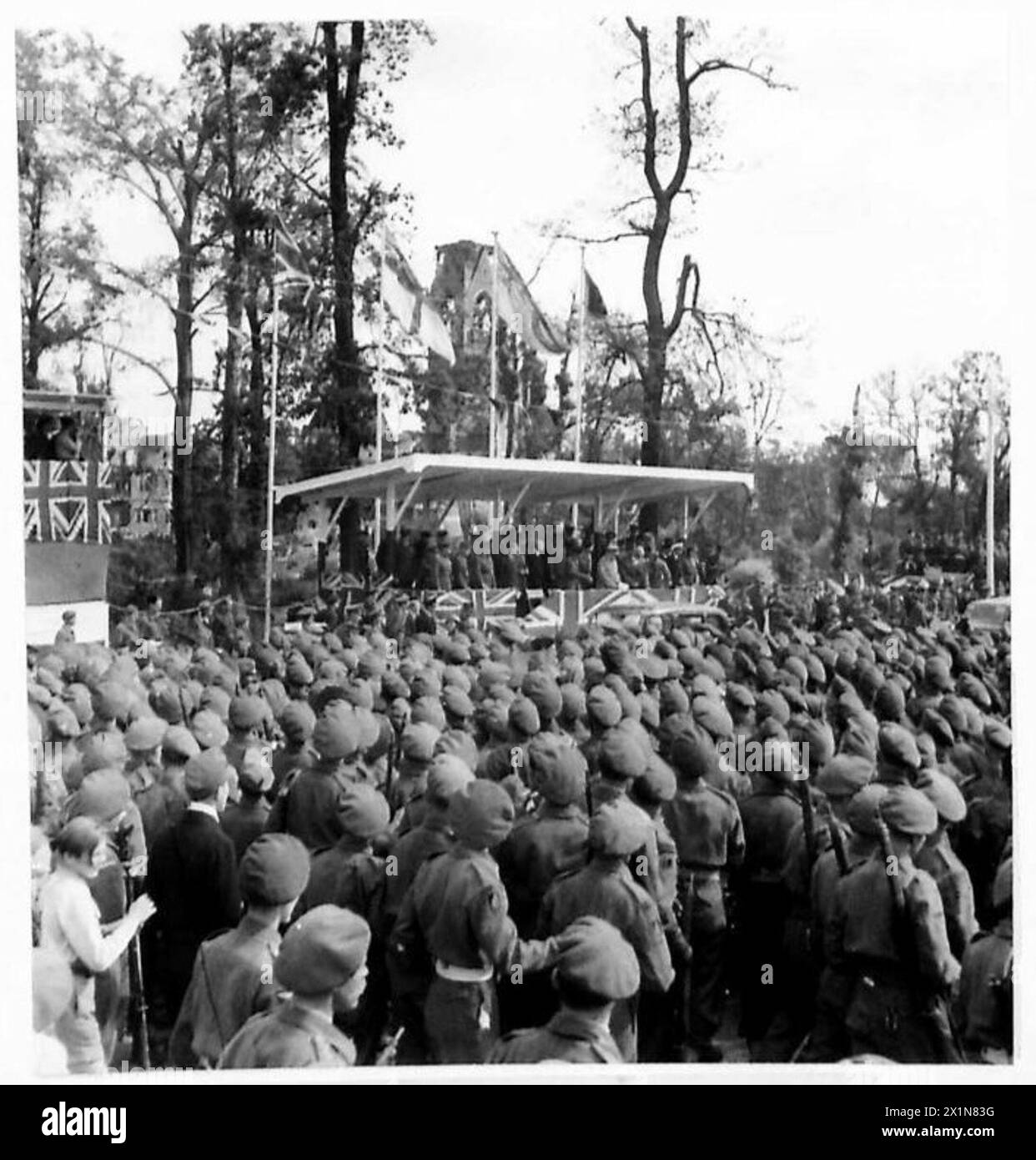 BRITISH VICTORY PARADE IN BERLIN - Troops surge round the saluting base ...