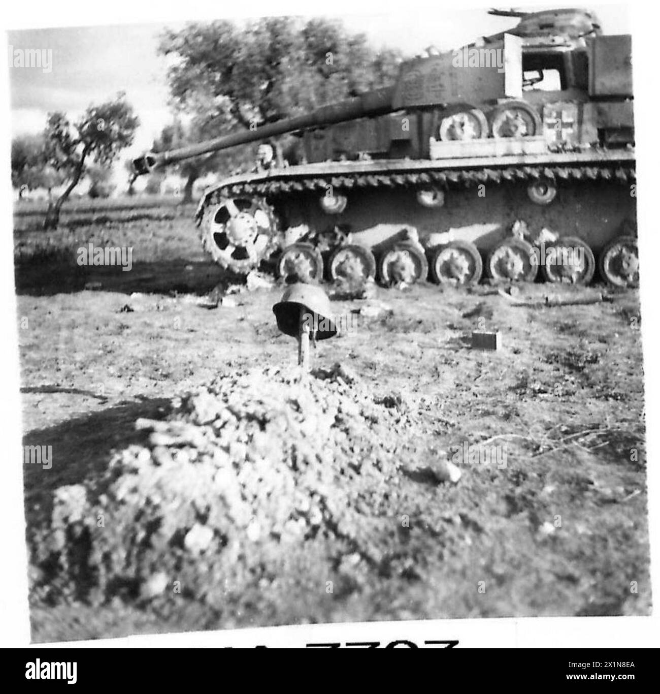 A German Mk IV tank destroyed and a German grave are observed on the ...