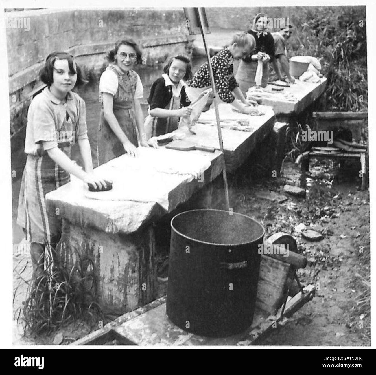 DOING TOMMY'S WASHING - French peasants, including quite young girls ...