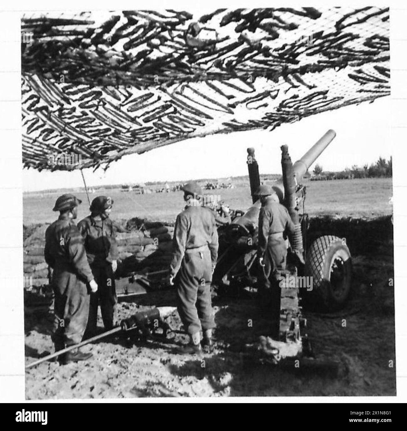 5.5 MEDIUM GUNS IN ACTION. - The gun team laying their gun for bearing ...