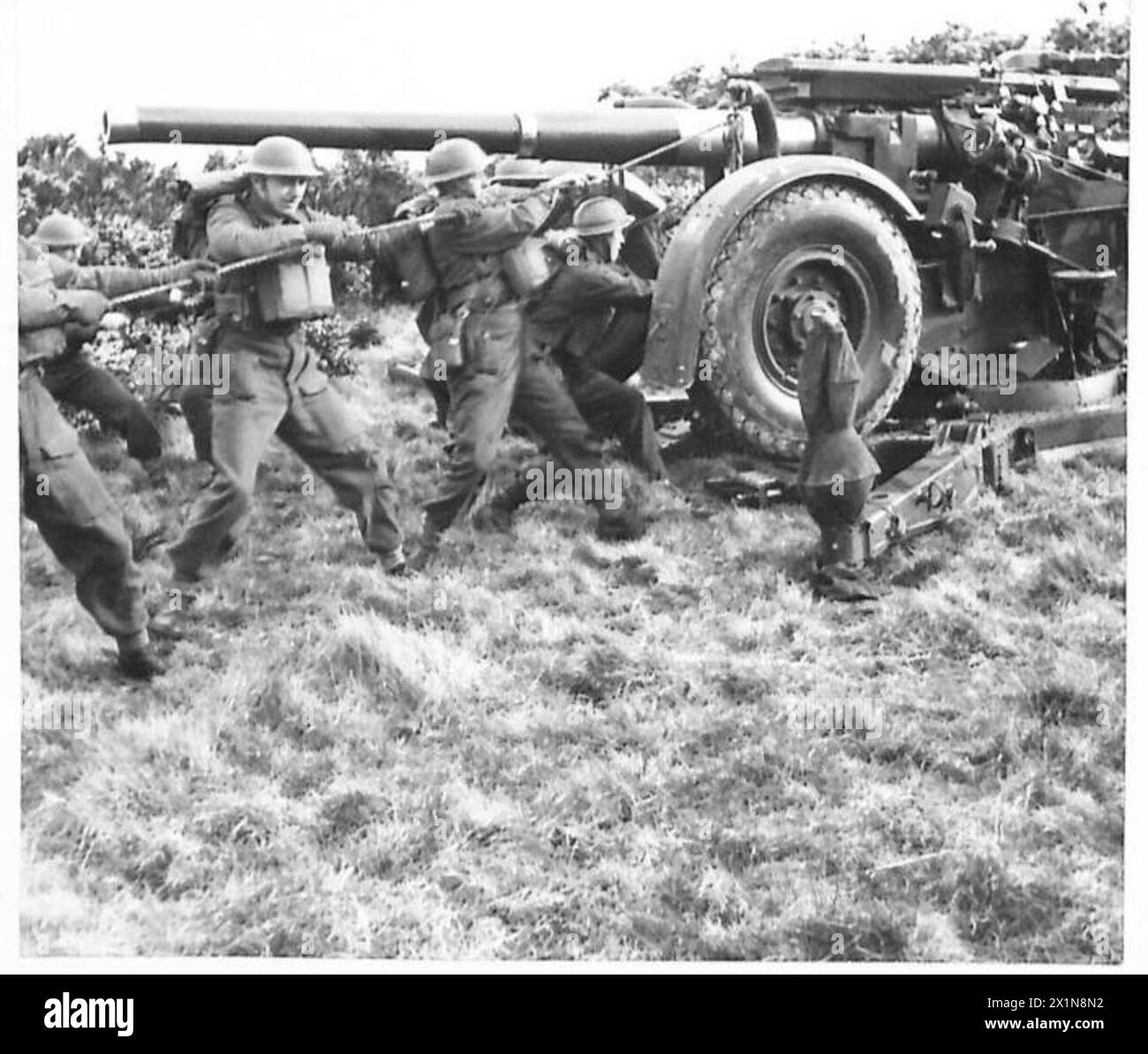 Anti-aircraft gunners practice positioning and securing their guns ...