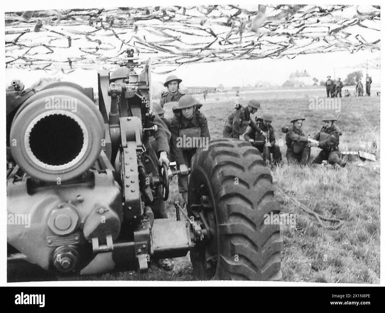 SIX INCH HOWITZERS IN ACTION - A Howizter being hauled into postion ...