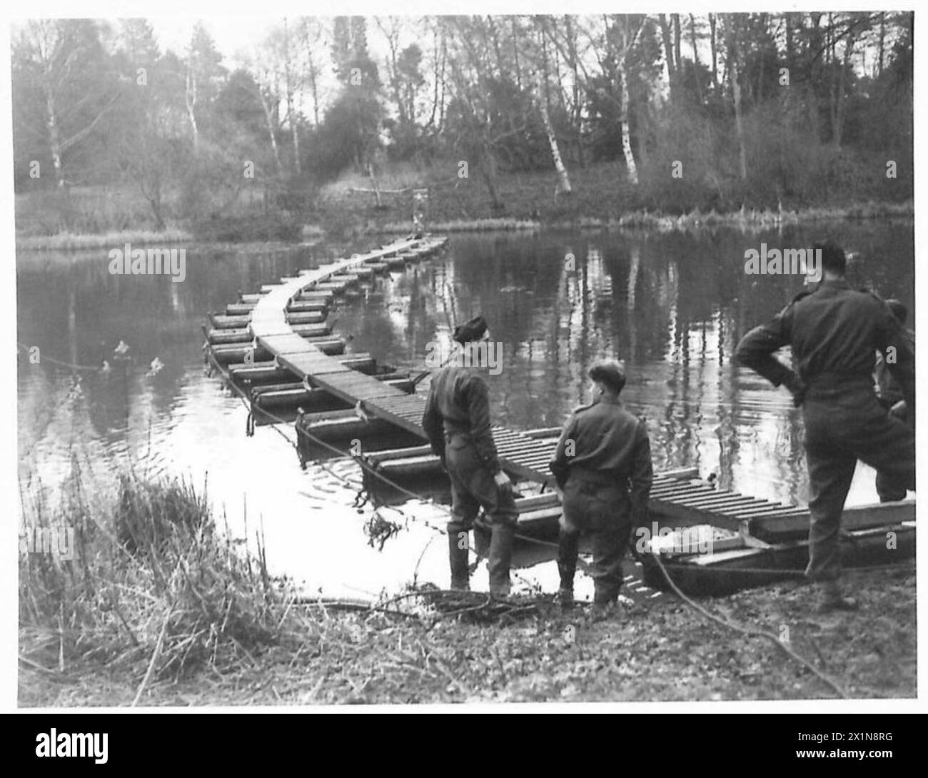 BUILDING A KAPOK BRIDGE - The bridge in the water. It nearly reaches to ...