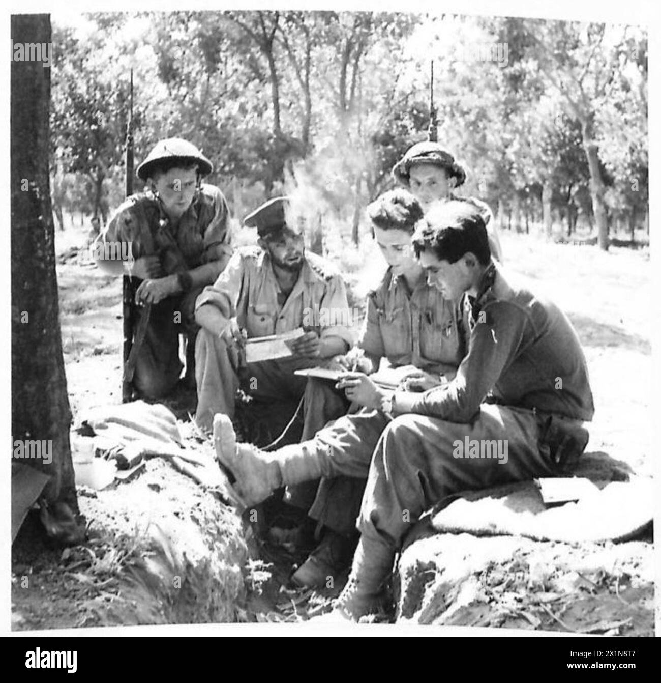 Major G.C. Delforce of the 9th Royal Fusiliers interviews a patrol ...