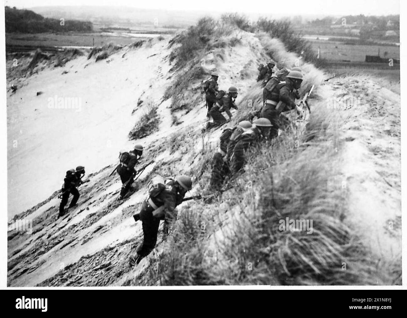BELGIAN TROOPS IN TRAINING - A squad advancing over the sand dunes ... BELGIAN TROOPS IN TRAINING - A squad advancing over the sand dunes ...