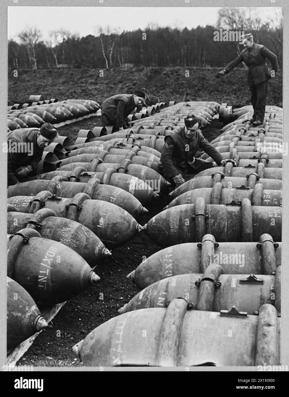 MEN WHO MAINTAIN THE BOMBERS - 12520 Picture (issued 1944) shows - A ...