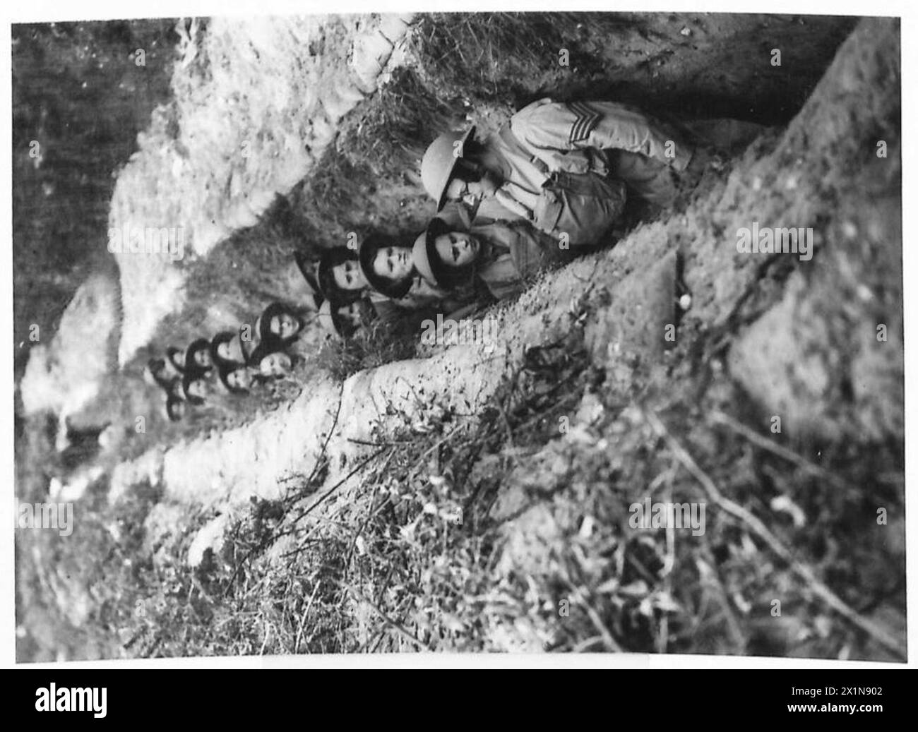 Women take cover in hi-res stock photography and images - Alamy