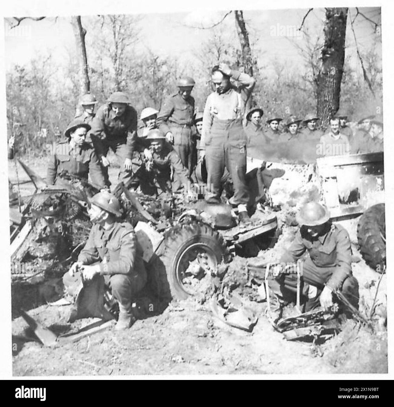 Men of a British Army regiment are photographed amid the wreckage of a ...