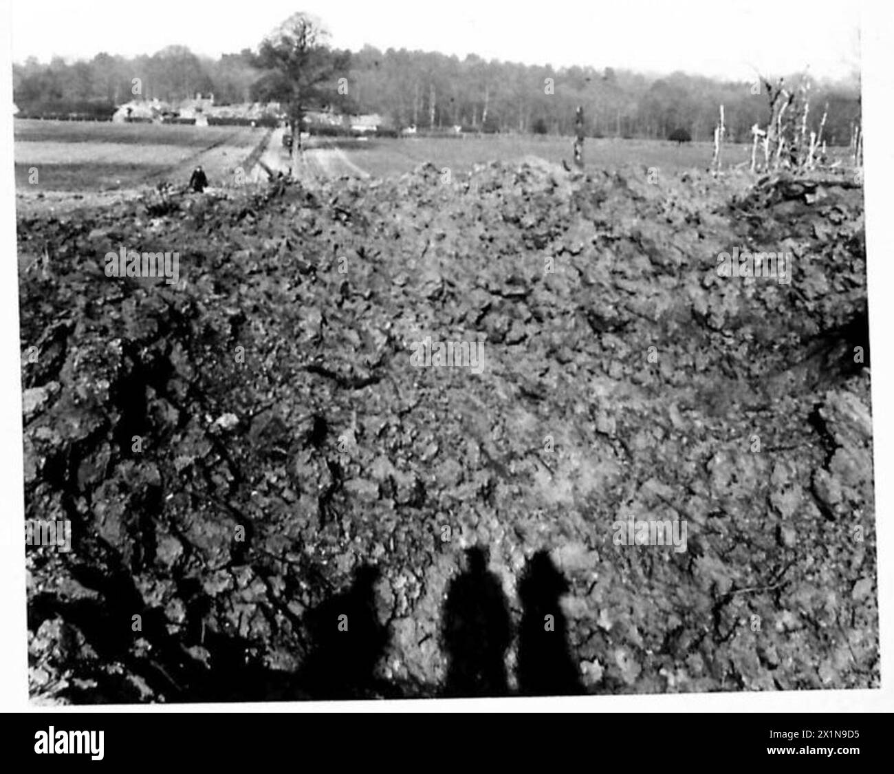 AMMUNITION DUMP EXPLODES - These pictures show the crater and debris ...