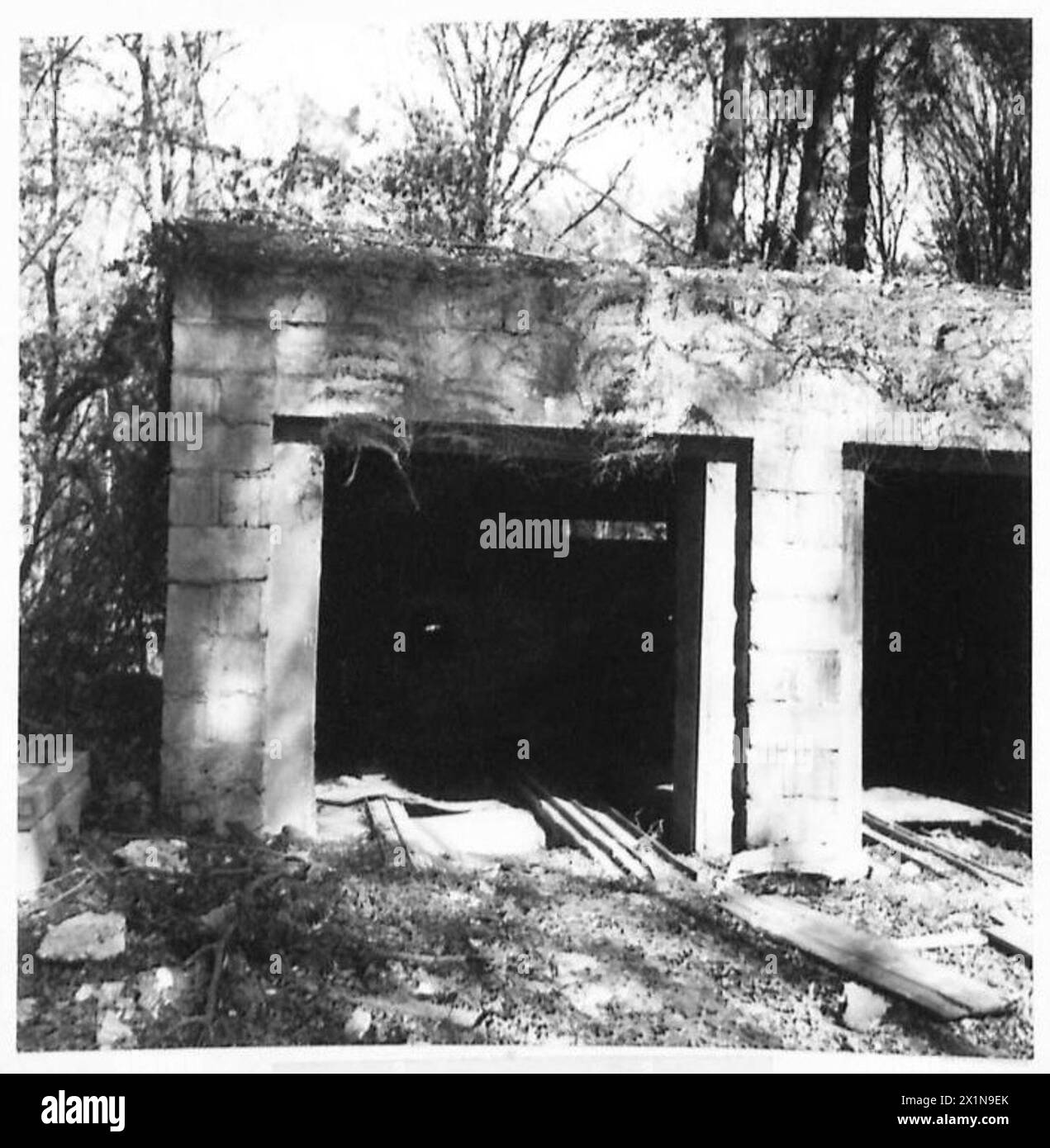 A flying bomb site destroyed by RAF bombing shows a concrete shed with ...