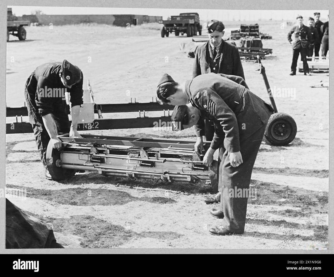Royal Air Force personnel are shown preparing fire-bombs for deployment ...