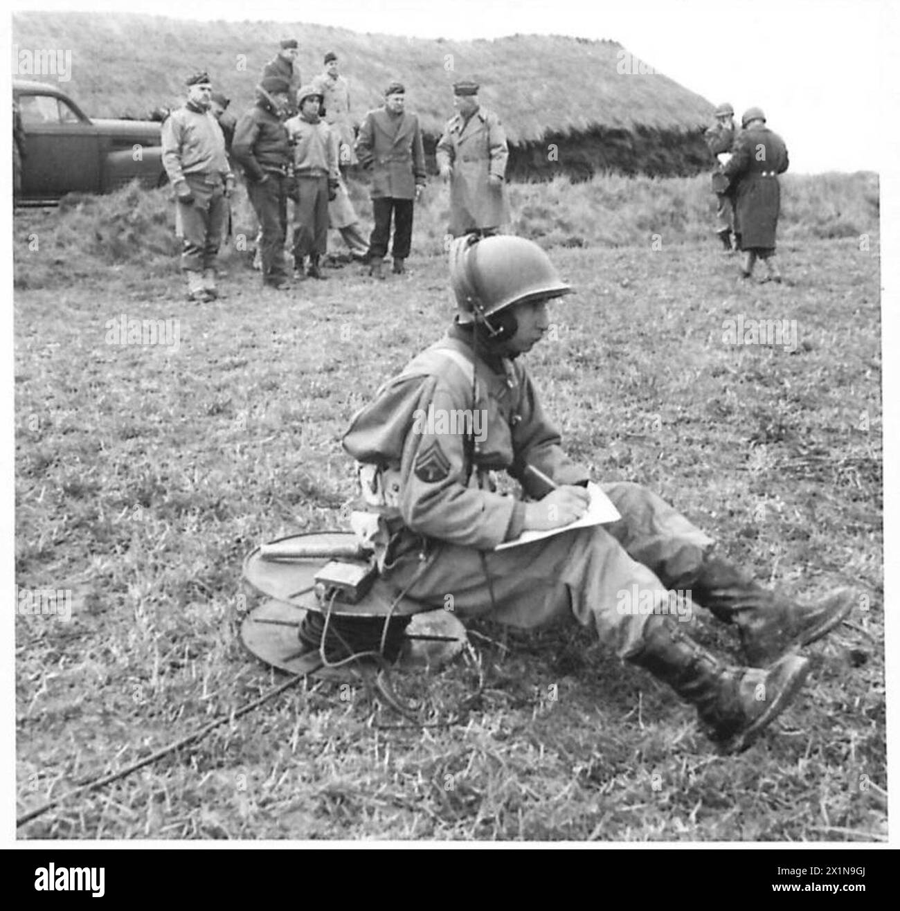 Allied commanders observe British and American troops while a U.S. Army ...