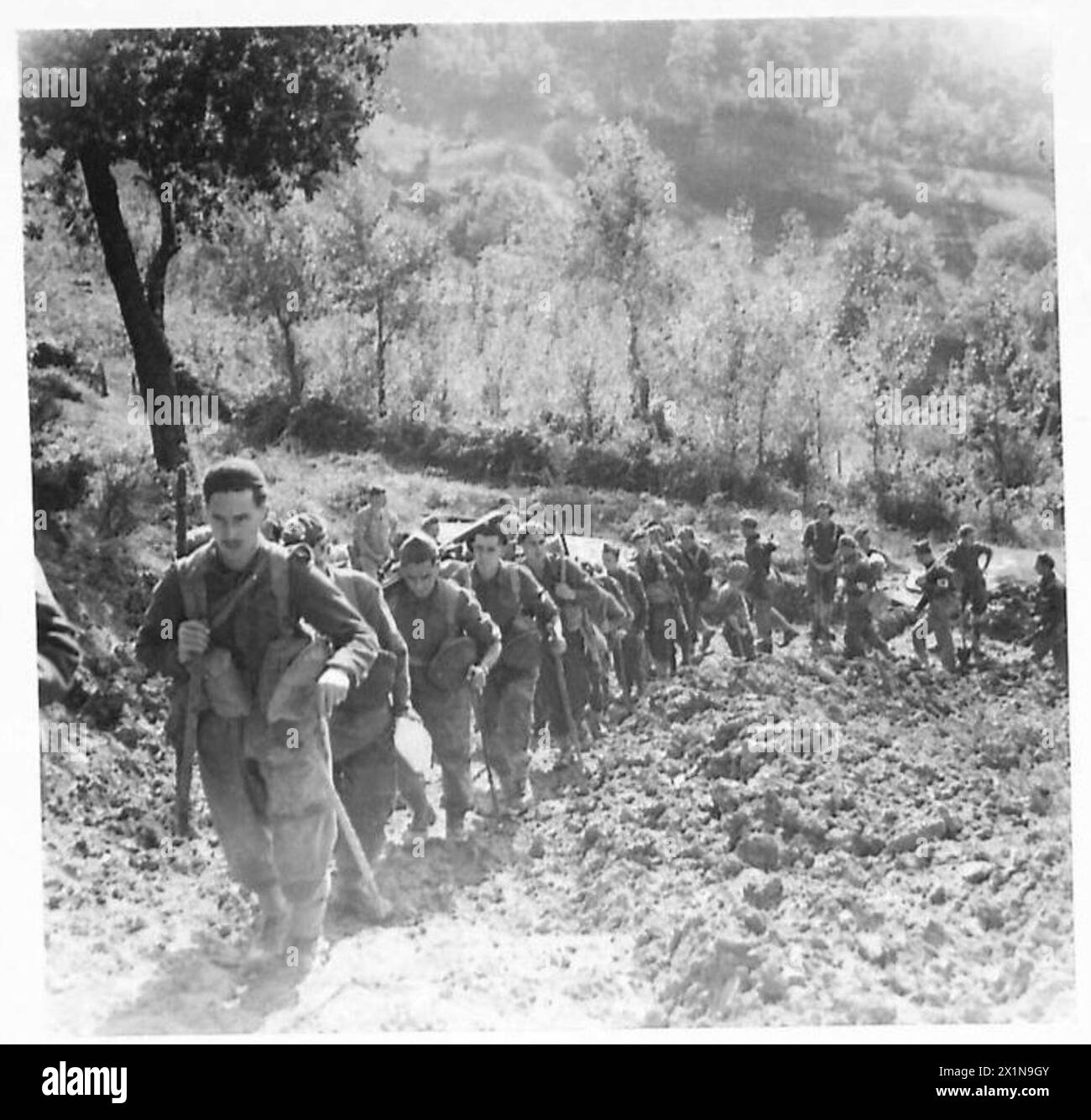 Fifth Army guardsmen make a strenuous climb to forward positions ...