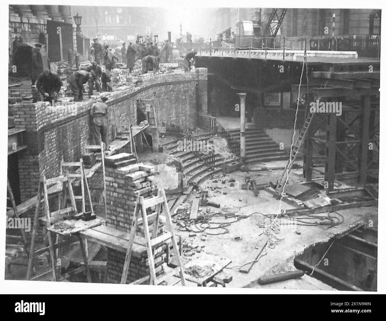 R.E.s CLEAR UP BOMB DAMAGE - This set of pictures show men of the Royal ...