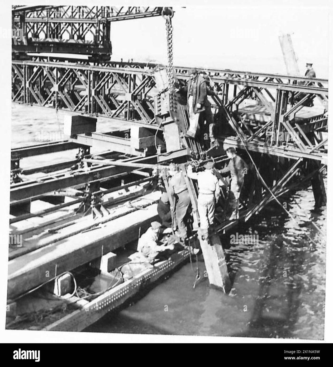 Photographs showing the large raft and 'V' trestling pier at high water ...