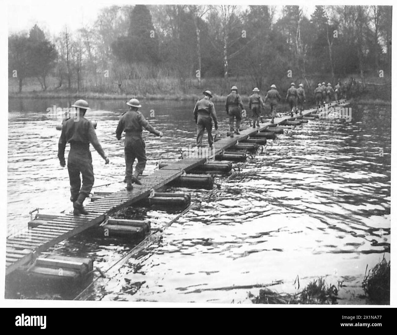 BUILDING A KAPOK BRIDGE - The finished bridge with troops crossing ...