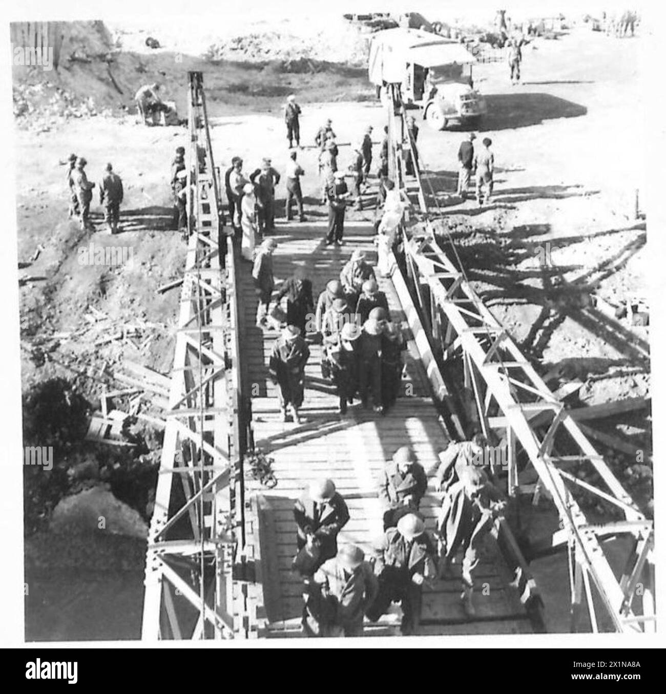 Wounded British and German troops are evacuated aboard an LST en route ...