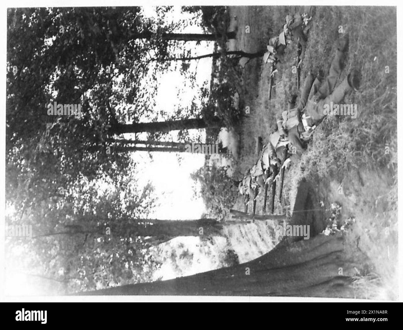 YORK AND LANCASTER REGIMENT IN TRAINING - An outpost takes cover by the ...