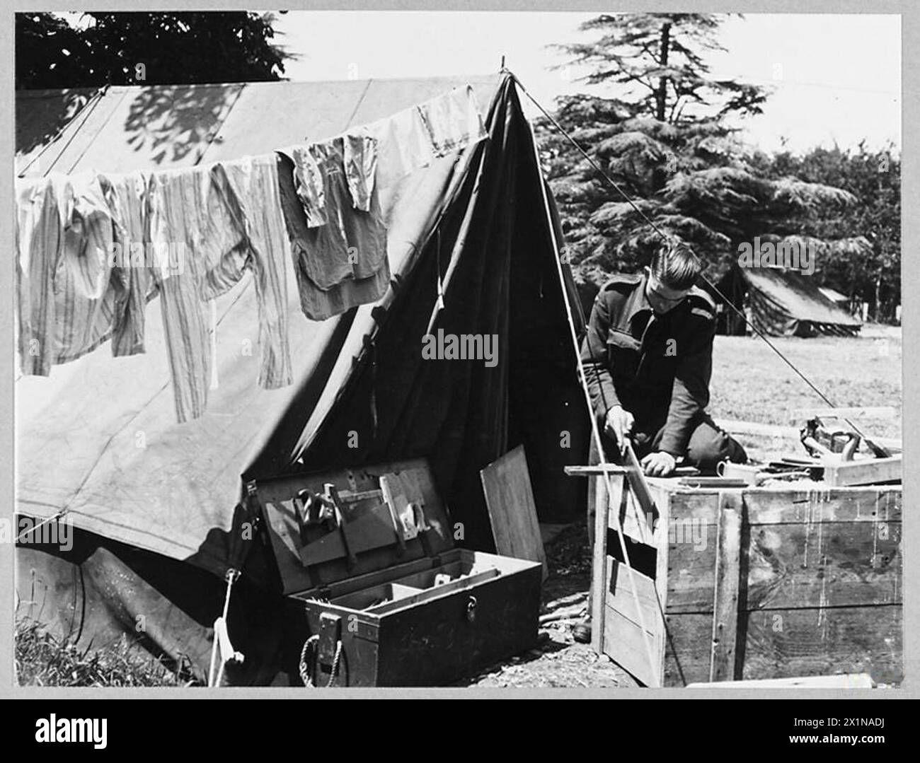 Aircraftman Ernest Trevor Adams works as the camp carpenter at an RAF ...