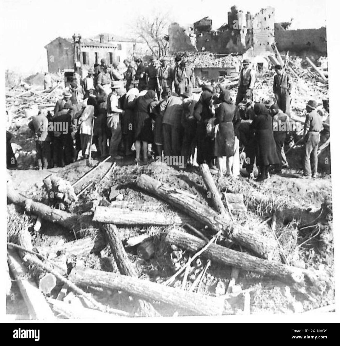 EIGHTH ARMY : VARIOUS - Civilians digging in the ruins of houses in ...