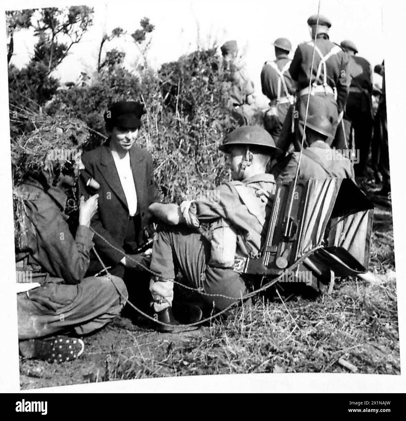 The Hon. Mabel Strickland observes infantrymen at Battle School using ...