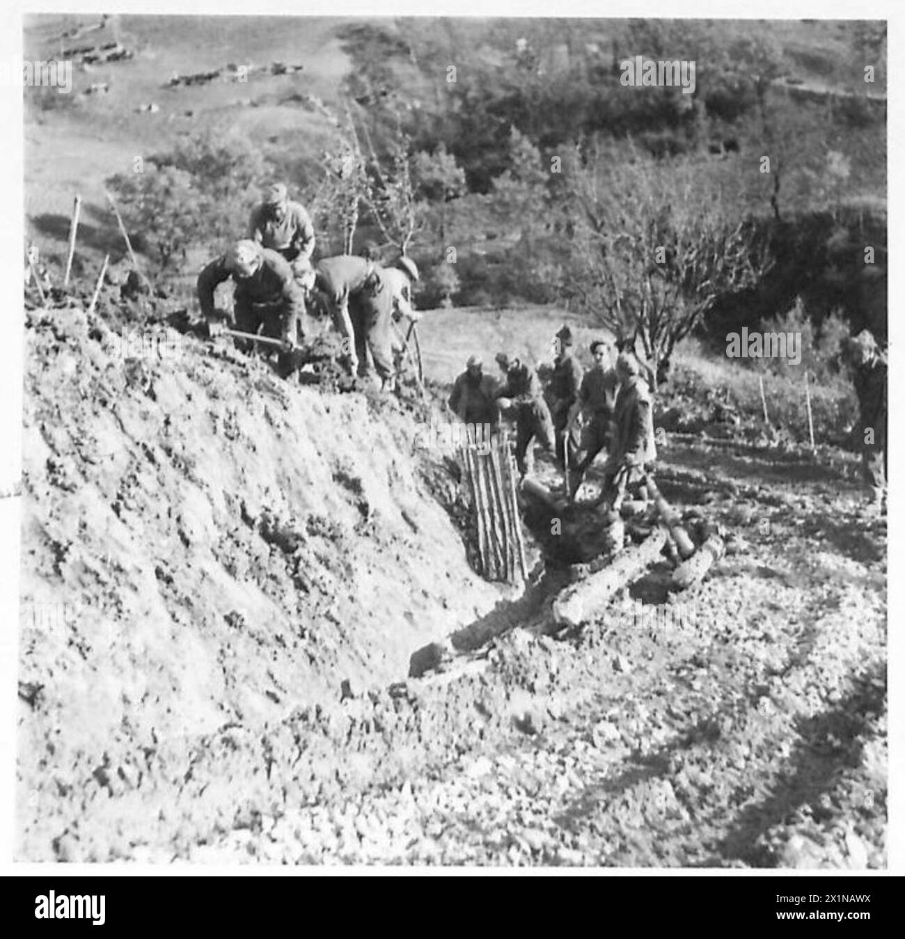 FIFTH ARMY : LOG ROAD - REs and Infantry digging a deep channel along ...