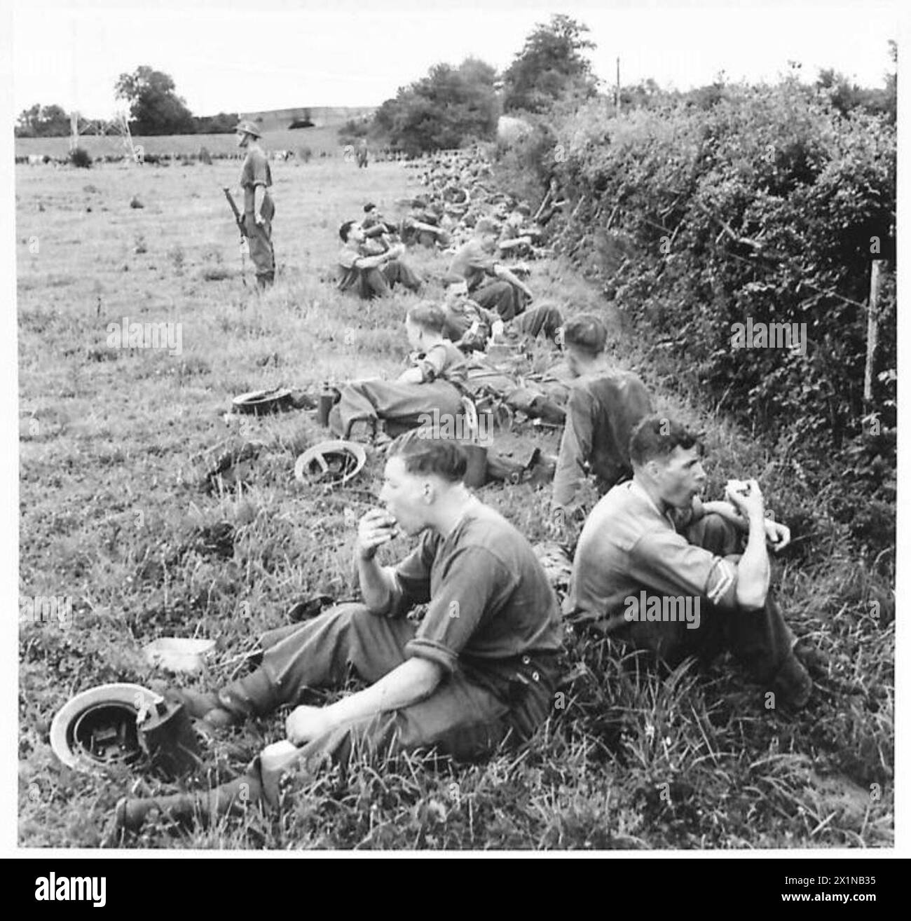 A young soldiers battalion takes a break for lunch and rest during a ...