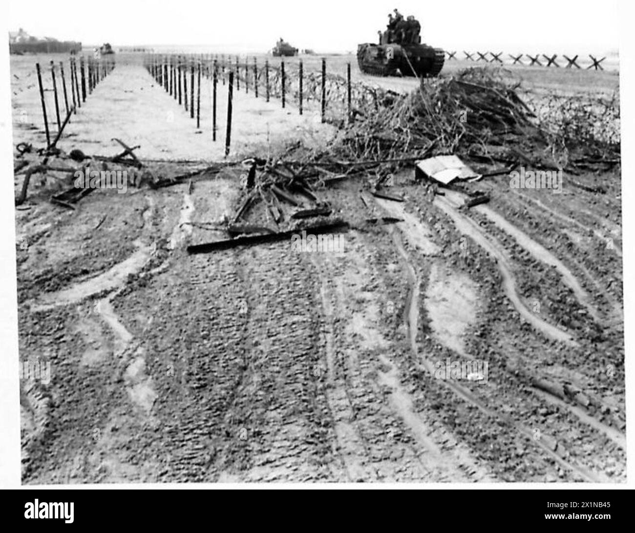 Close-up shows a fence being pulled by grapnels during a special ...