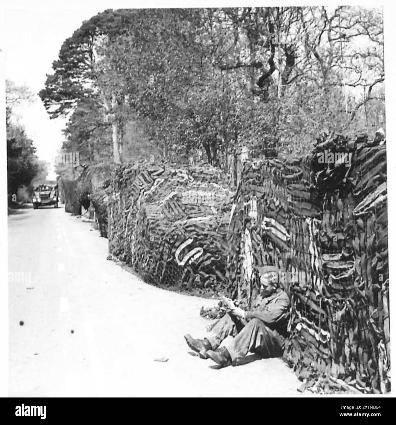 PREPARATIONS FOR THE SECOND FRONT - A driver writing a letter home ...