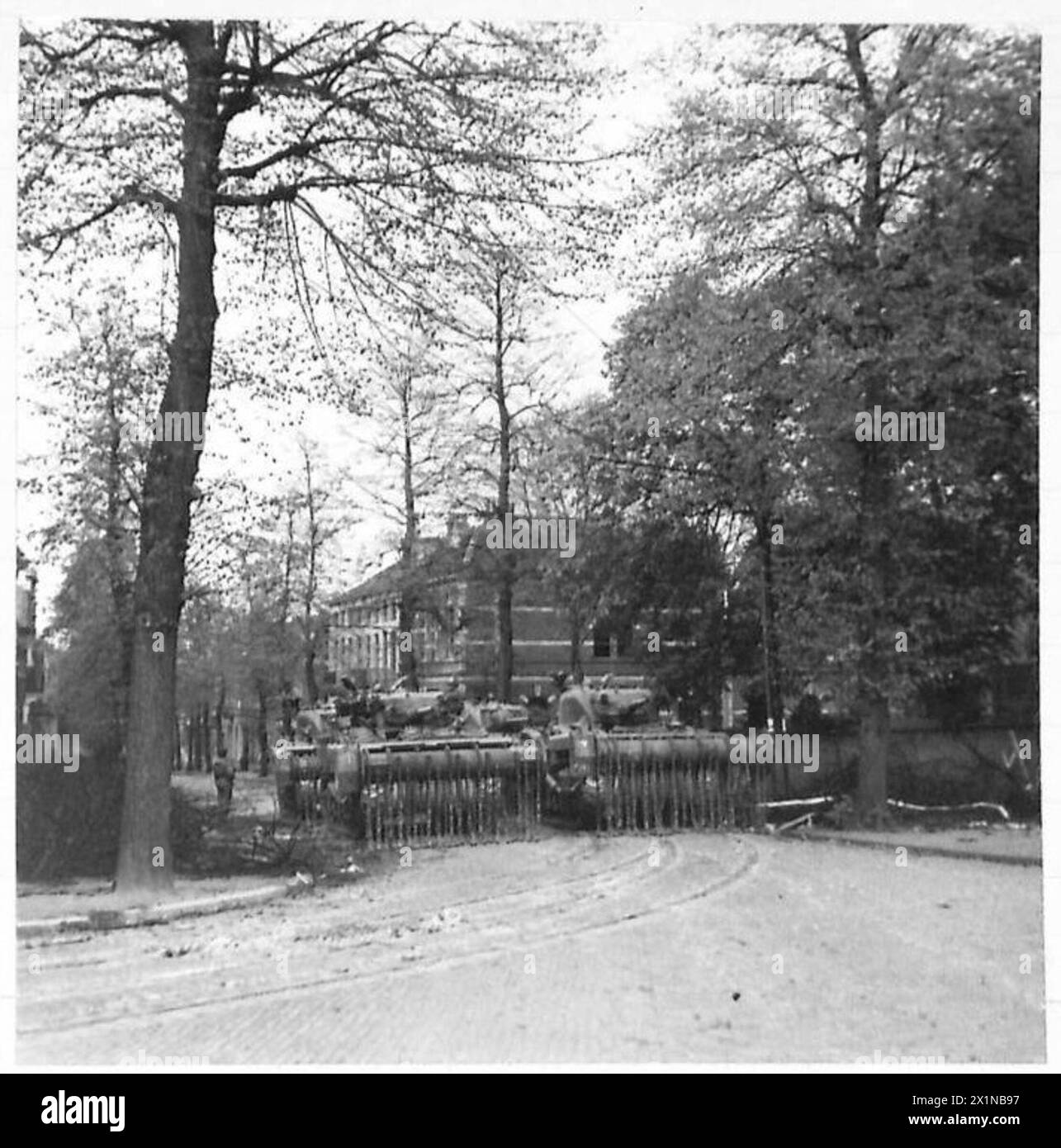 STREET FIGHTING IN ARNHEM - Flail tanks waiting to go through the town ...