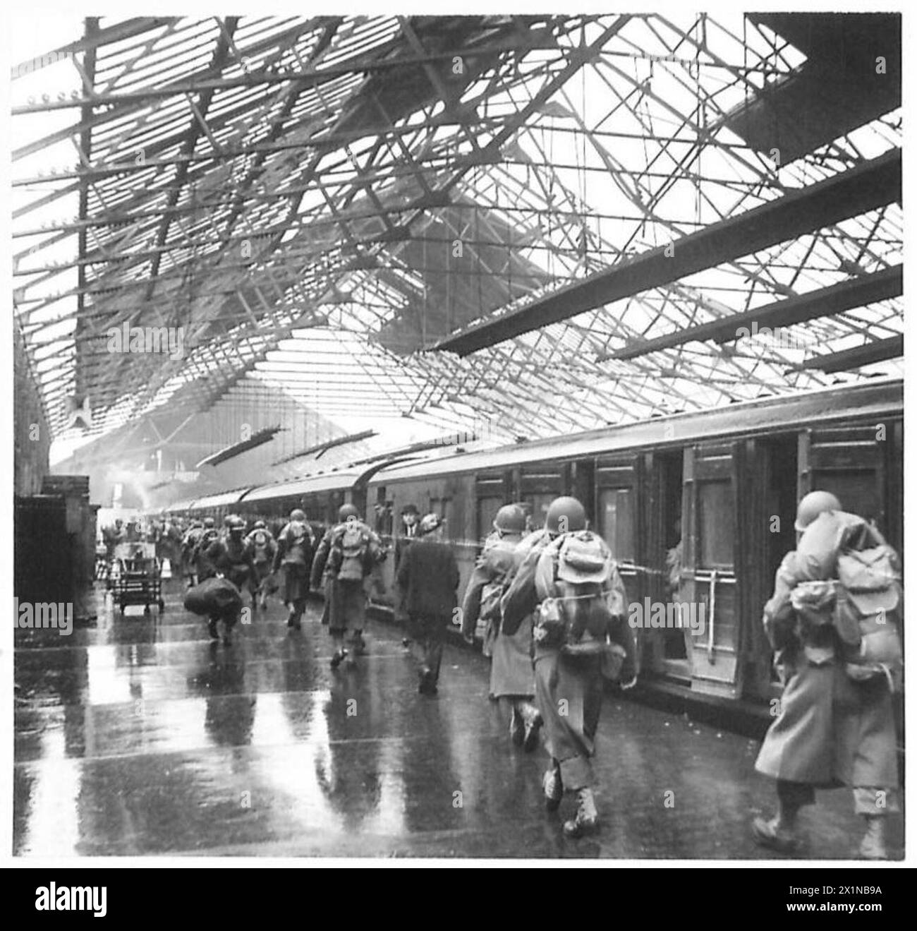 American troops board a train as additional contingents arrive ...