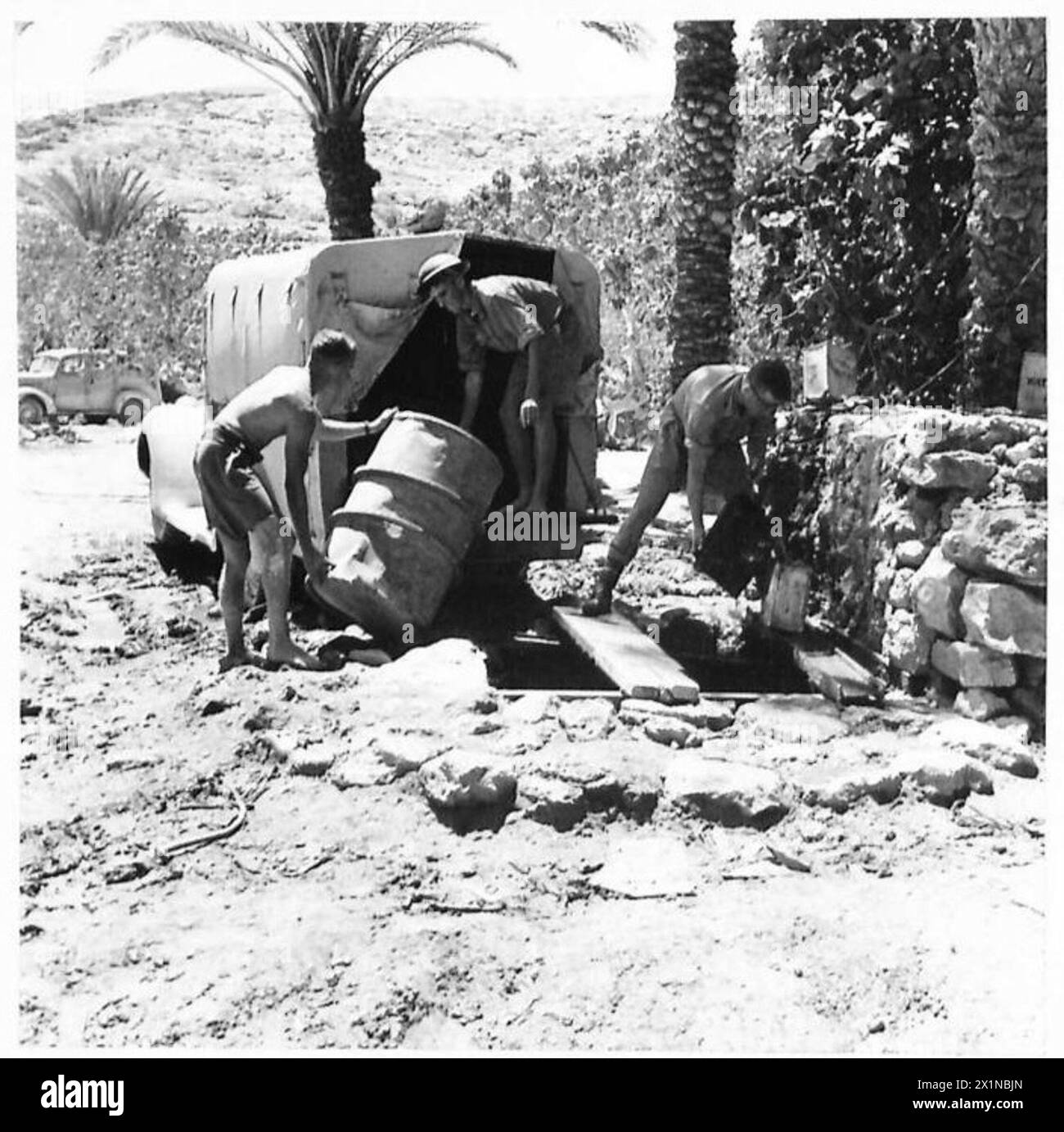 THE WATER WELL - Troops drawing water at one of the wells in Tobruk ...