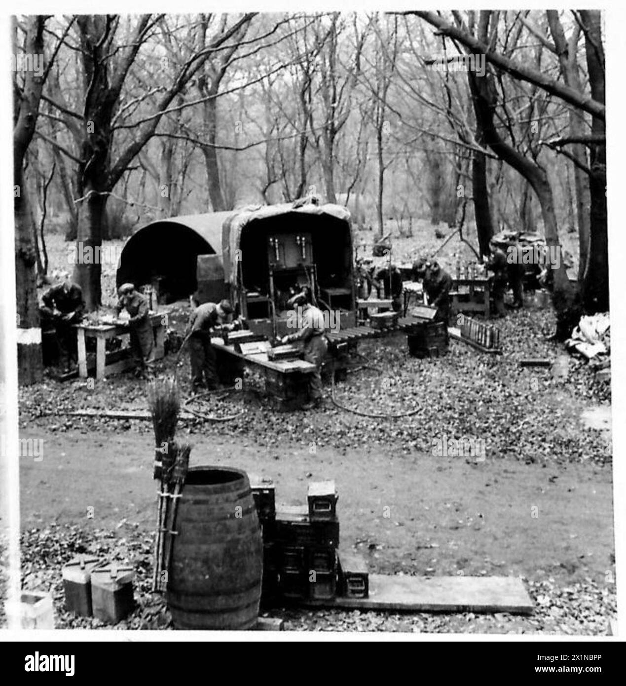 A mobile ammunition repair unit is shown at work repairing munitions ...