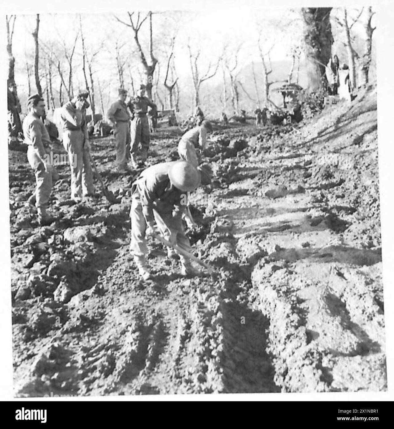 ITALY : FIFTH ARMY FRONT - Royal Engineers at work filling in deep ruts ...