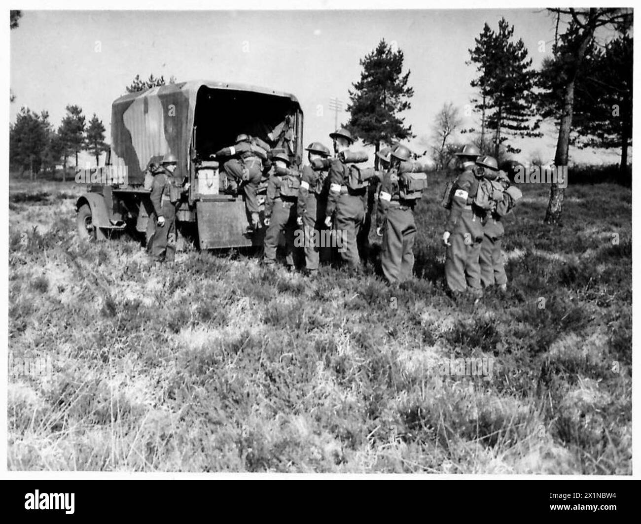 R.A.M.C. LIGHT AMBULANCE UNIT - Light section personnel climbing into ...