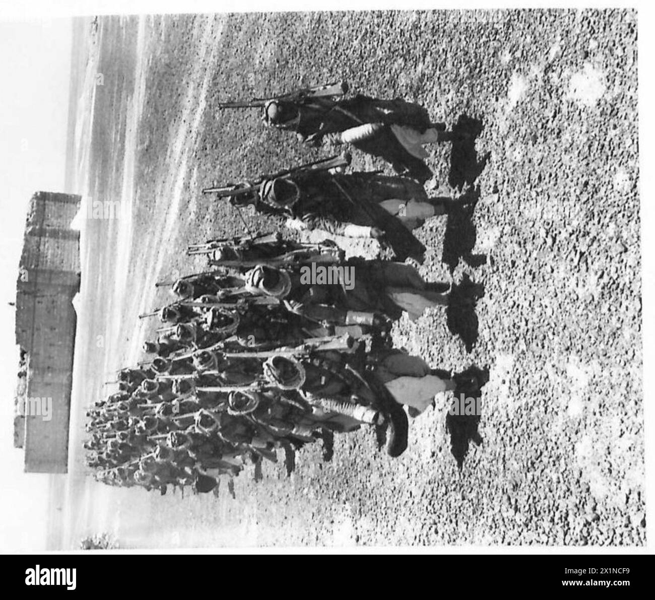 Men of the Desert Patrol of the Arab Legion march through the ...