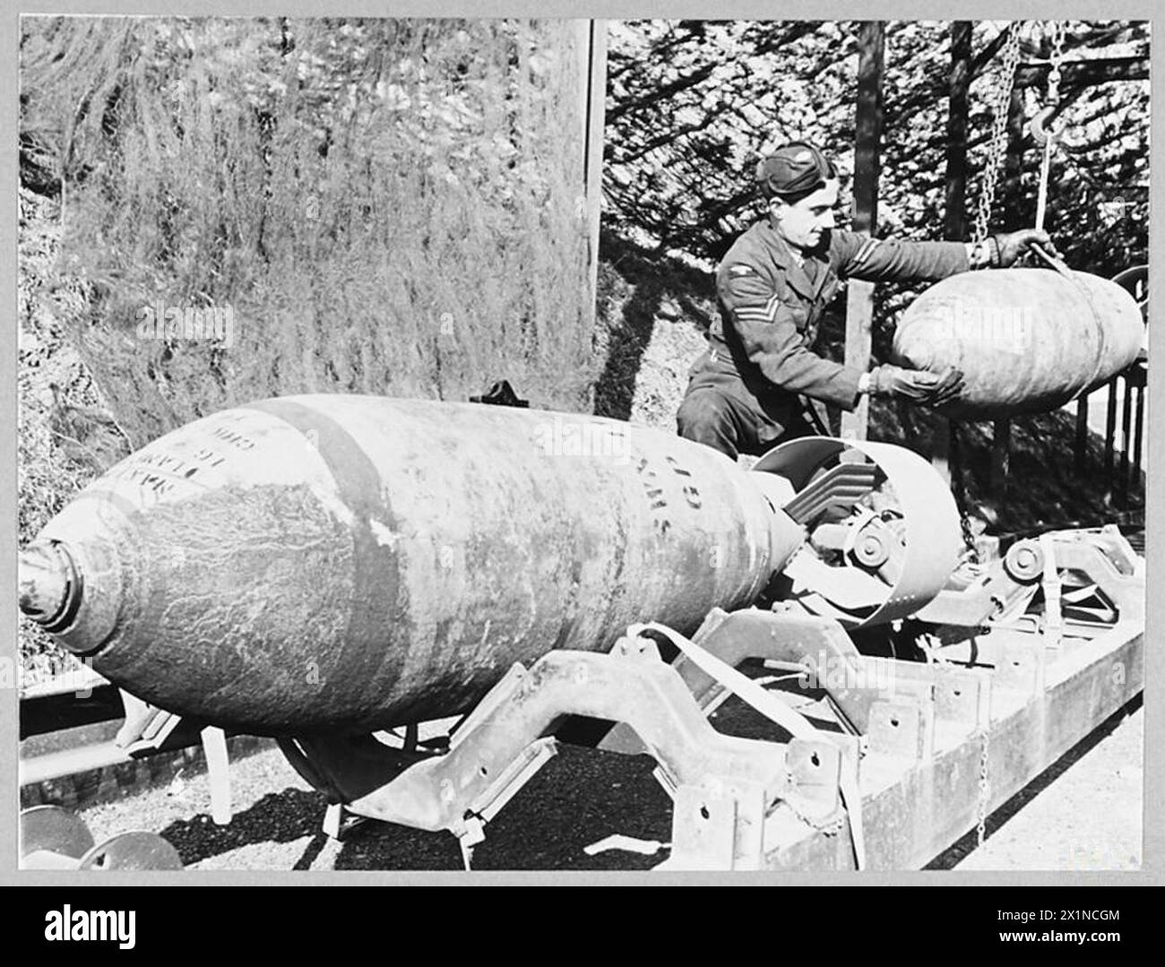 Bombs of 1000 lb. are prepared for an RAF raid on Axis targets; the ...