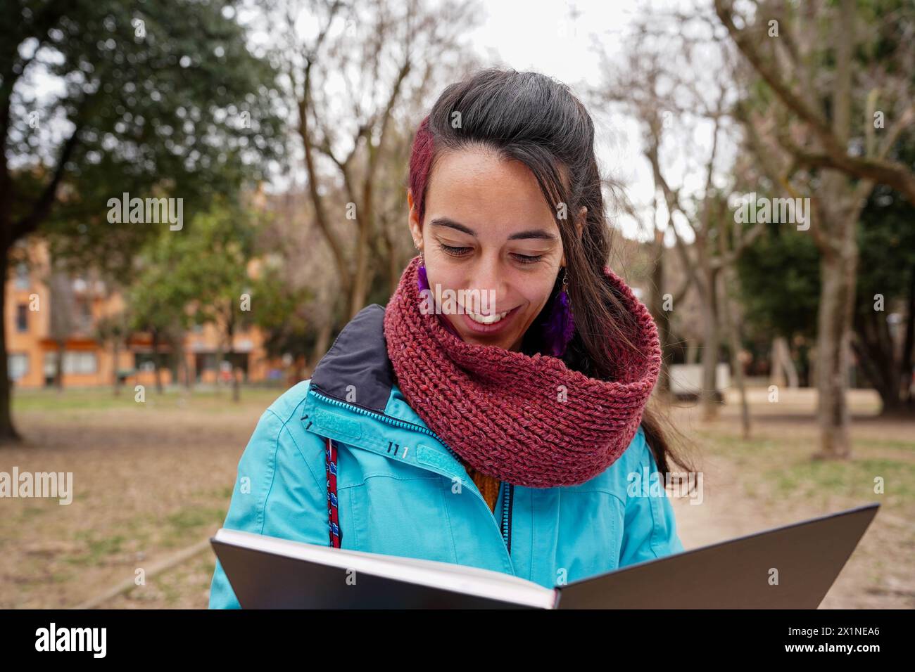 Person wearing red jacket hi-res stock photography and images - Alamy