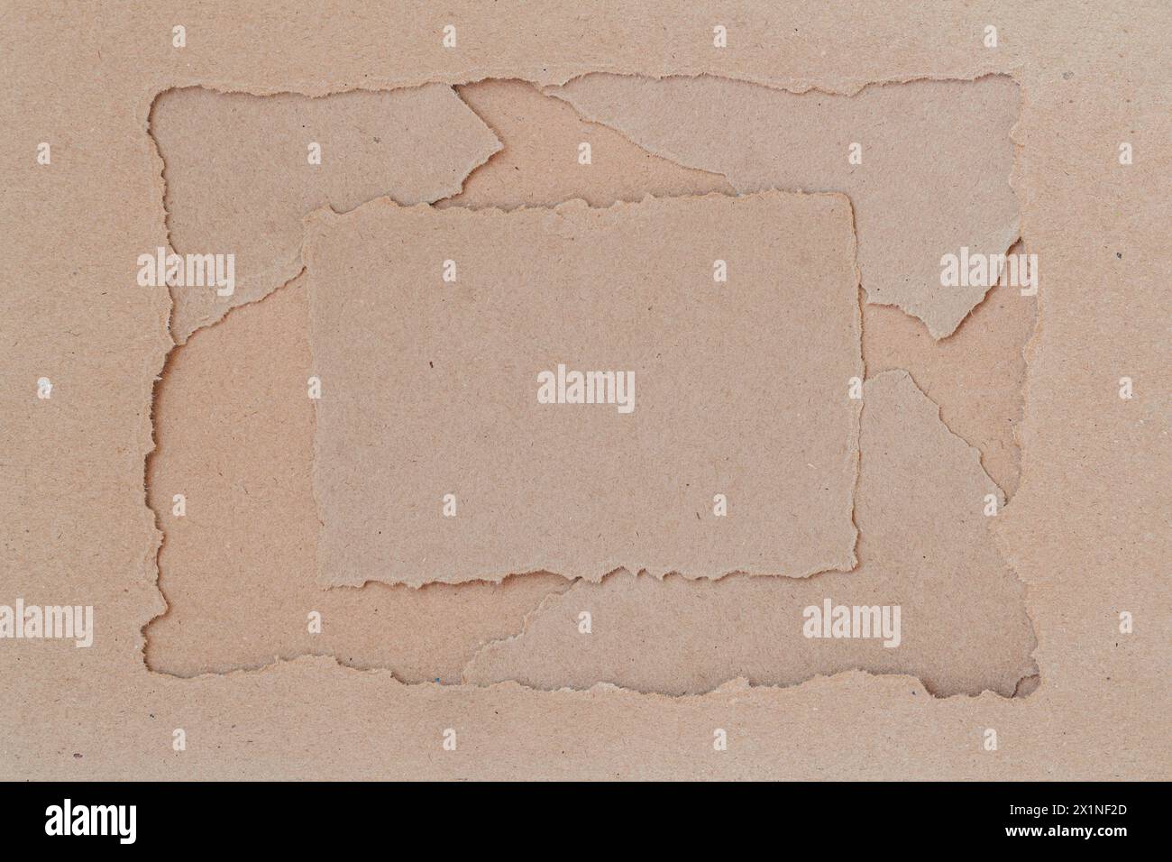 Recycled paper craft ripped pieces, in frame background, copy space ...