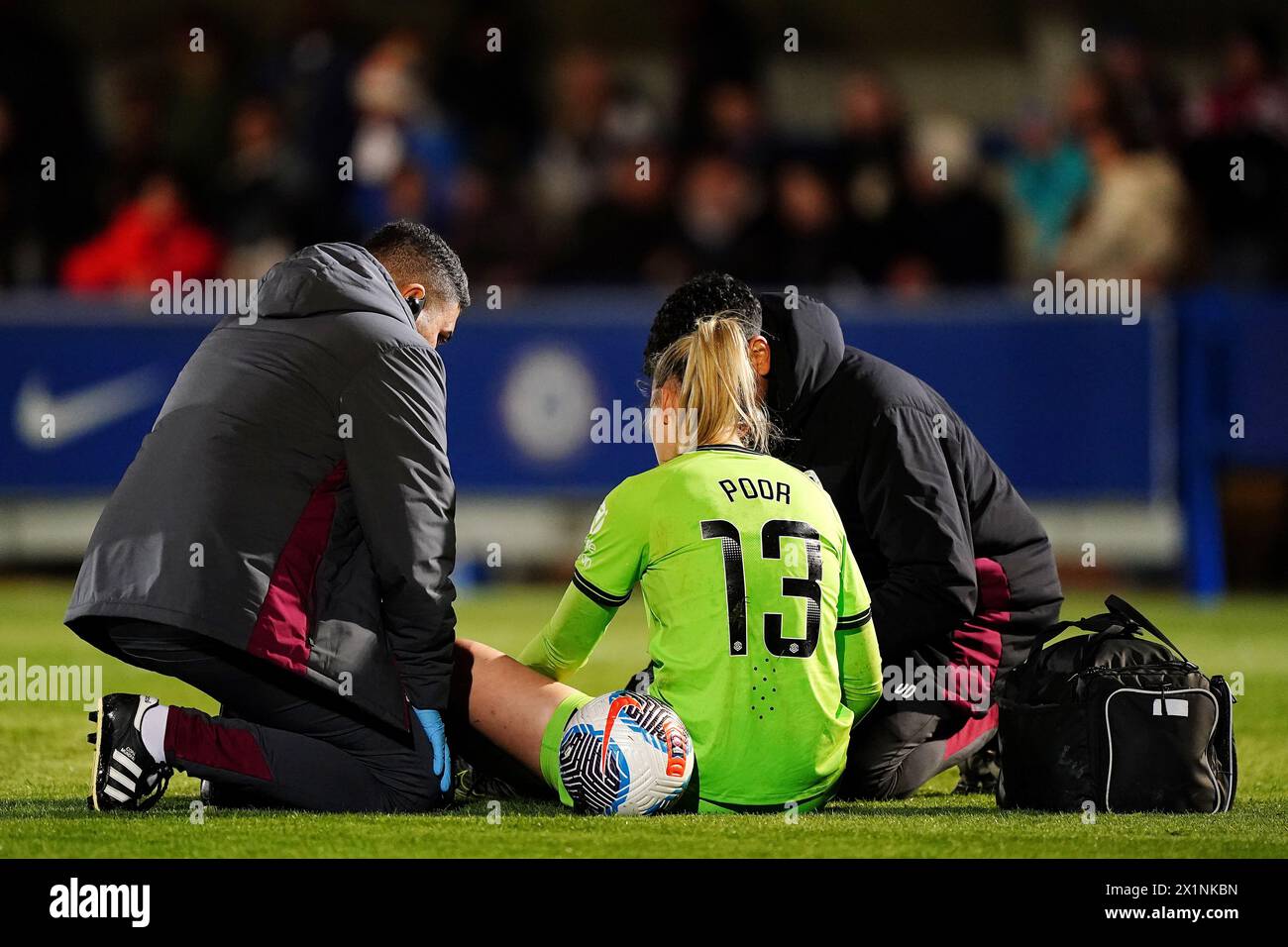 Aston Villa goalkeeper Sophia Poor receives medical treatment during ...