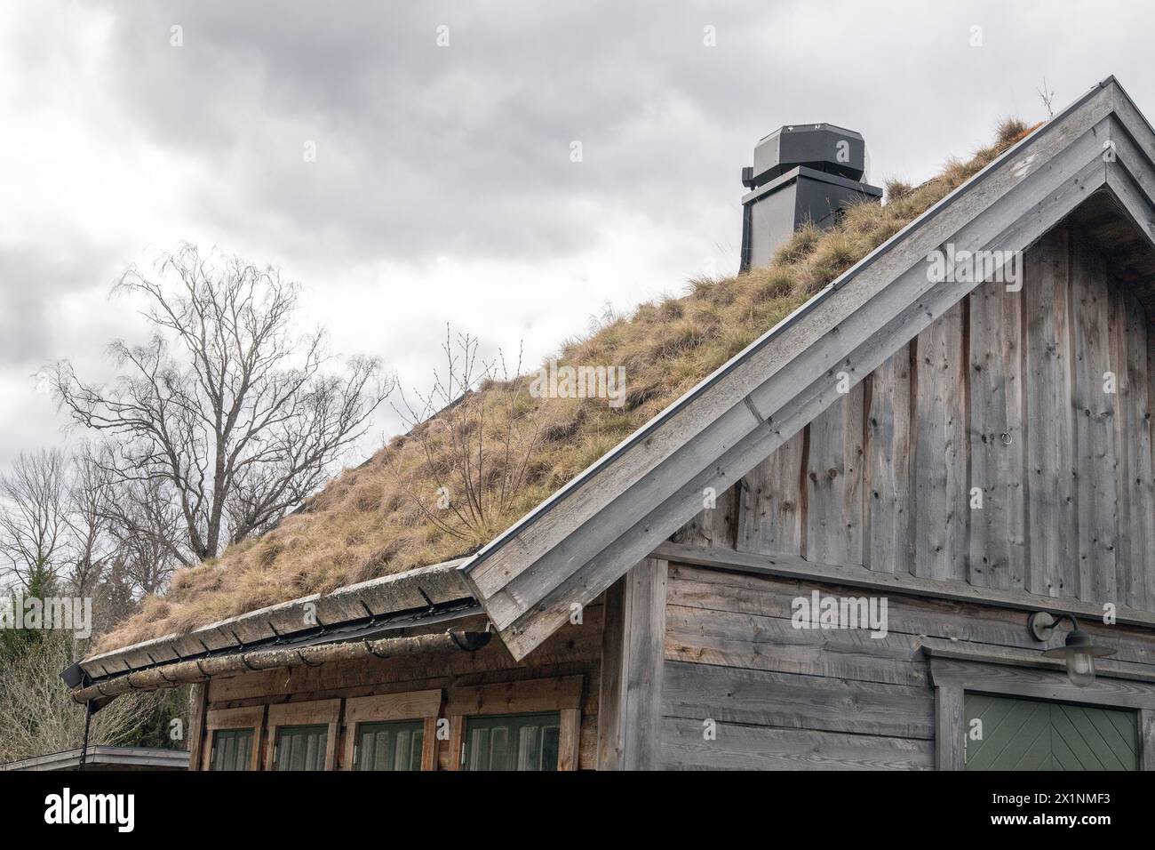 wooden house with turf roof Stock Photo - Alamy