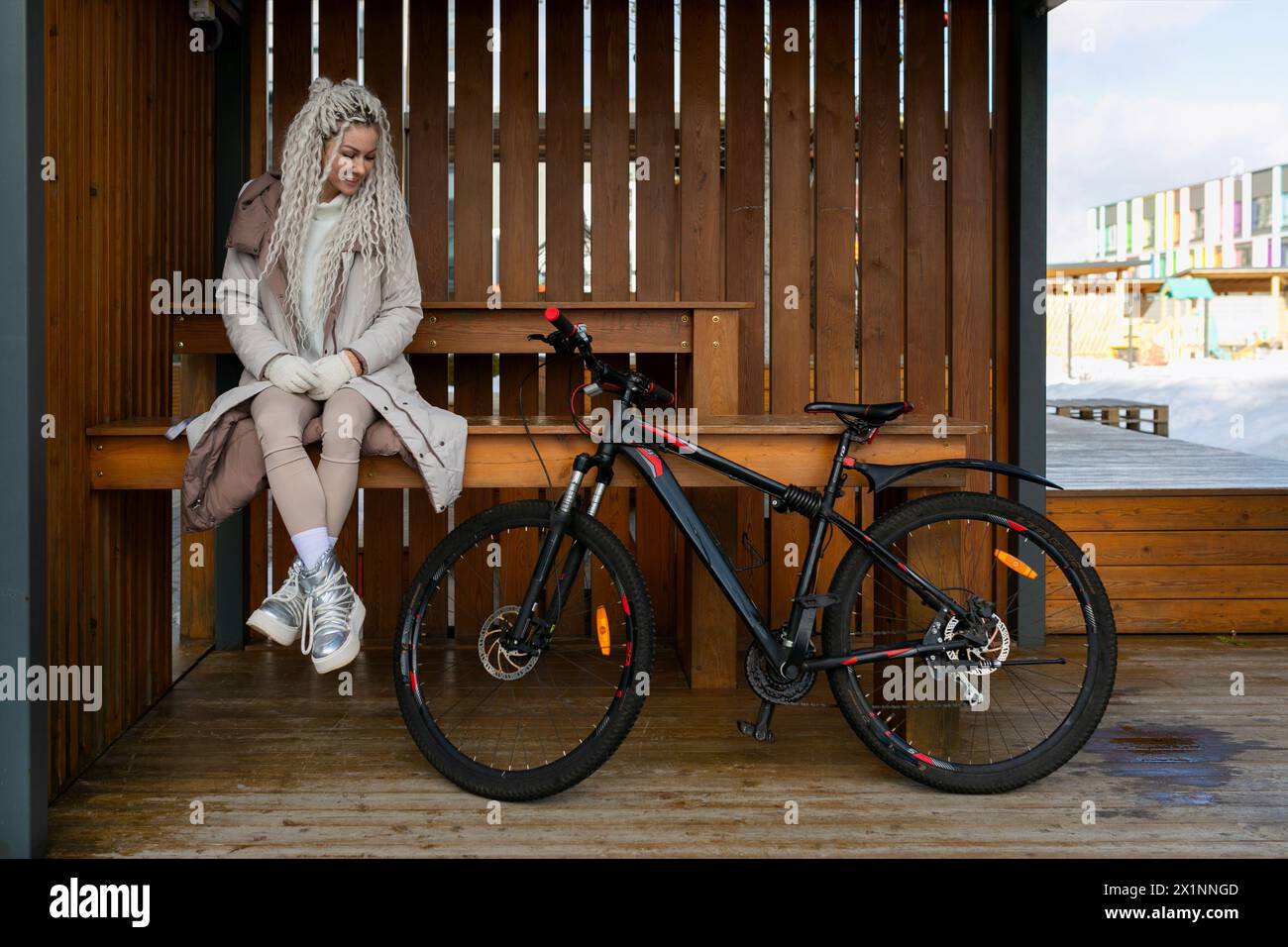 Female with bike resting on park bench hi-res stock photography and ...