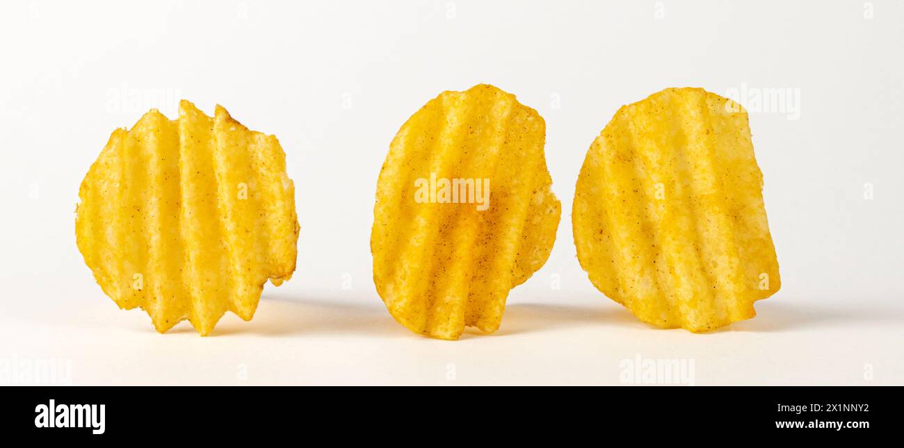 Three wavy chips on a white background with a cropped outline ...