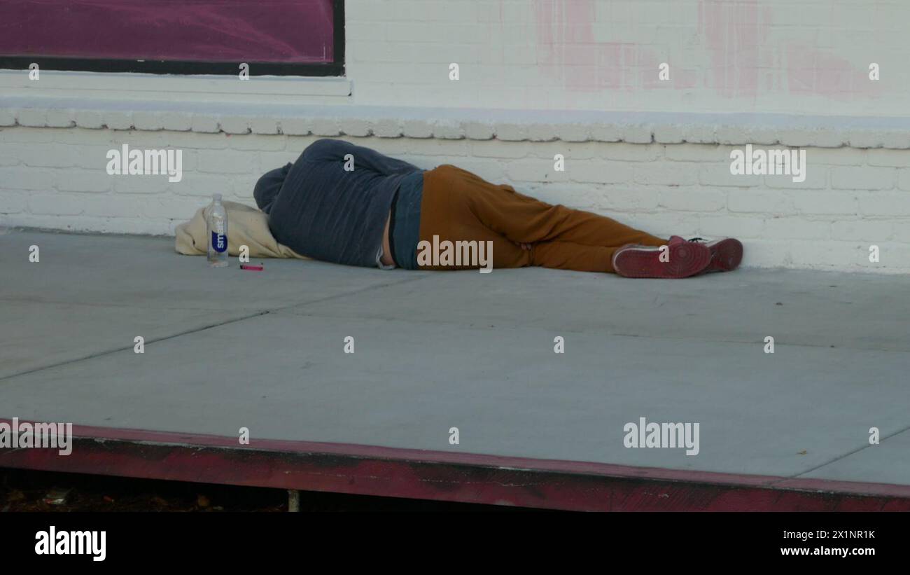 Los Angeles, California, USA 16th April 2024 Homeless man sleeping on ...