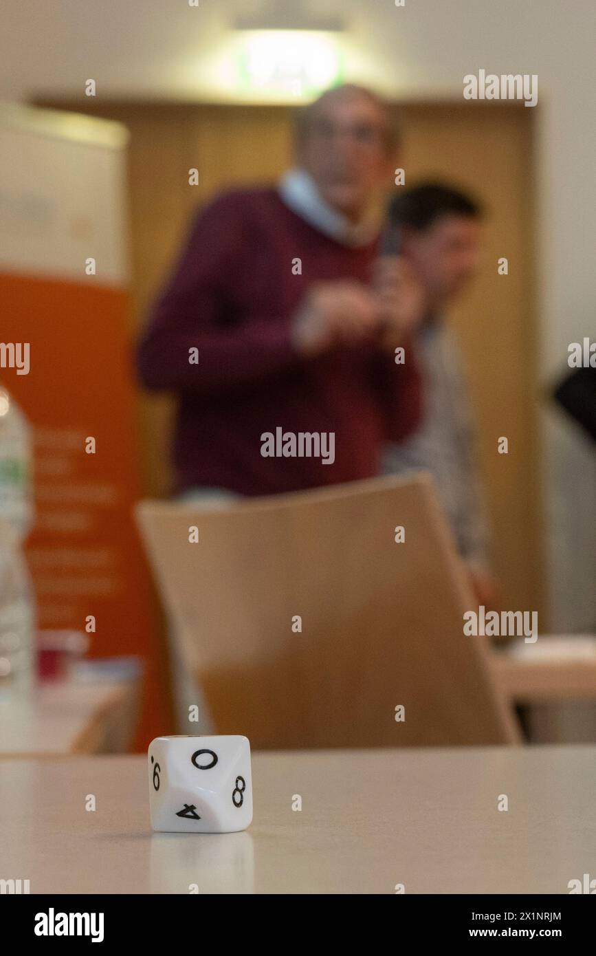 17 April 2024, Hesse, Frankfurt/M.: A dice that decides the winner is ...