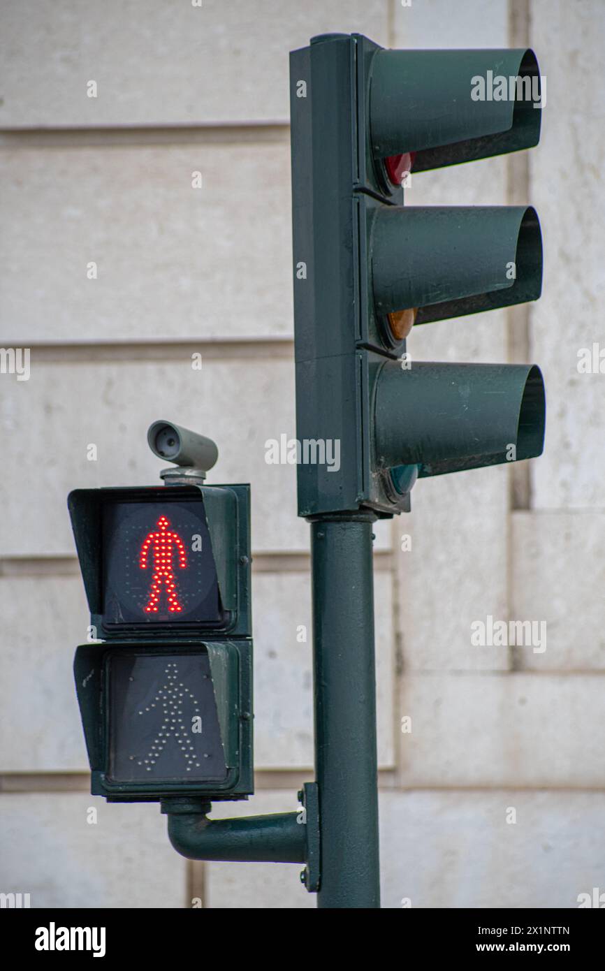 Red pedestrian crossing traffic light with blurred background of ...