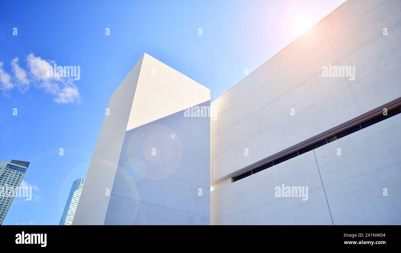 Sunlight and shadow on surface of white Concrete Building wall against ...