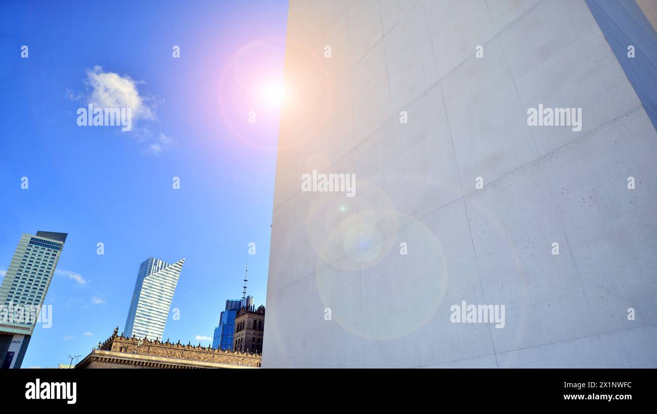 Sunlight and shadow on surface of white Concrete Building wall against ...