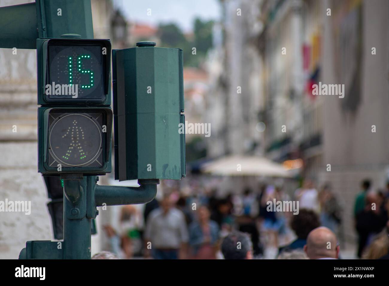 Green traffic light for pedestrians counting down in 15 seconds in ...